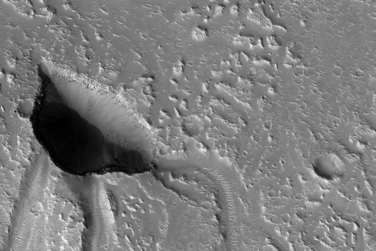 Nieuwe ontdekking: Donkere openingen op Mars kunnen een belangrijke ...